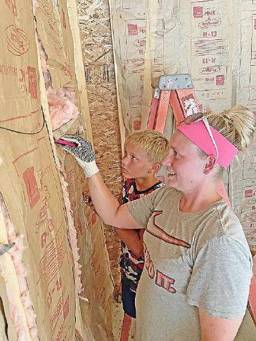 Batters up | The Courier Keisan Wainscott and Amy Lusk install batting ...