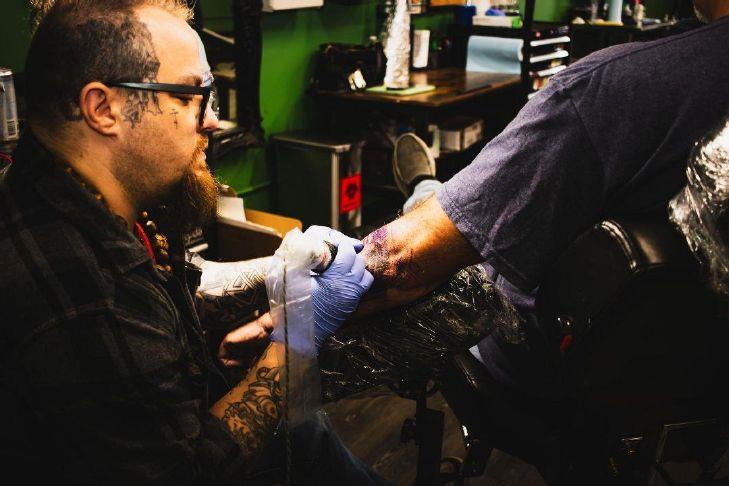 Small business, big community impact | Advertiser-Tribune Tattoo shop ...